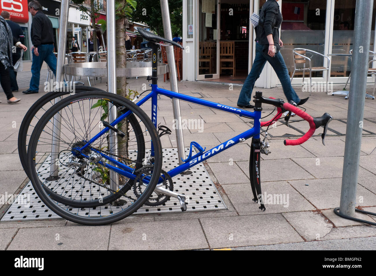 Safely parked bicycle with wheels properly secured on bicycle parking ...