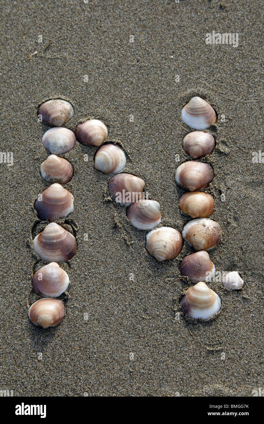 letter n formed on sandy beach on coast Stock Photo - Alamy