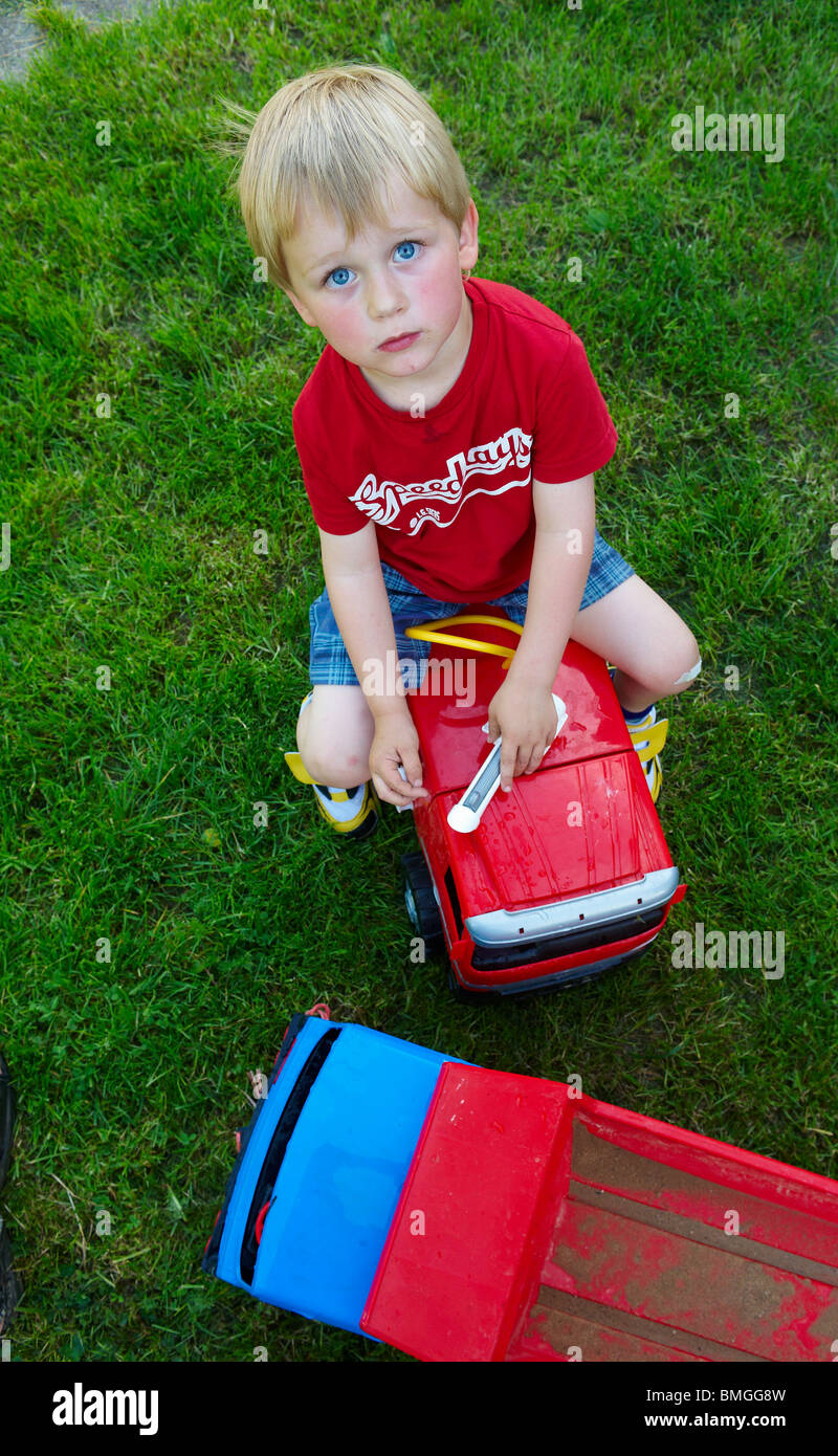 Boy with toy fire engine hi-res stock photography and images - Alamy