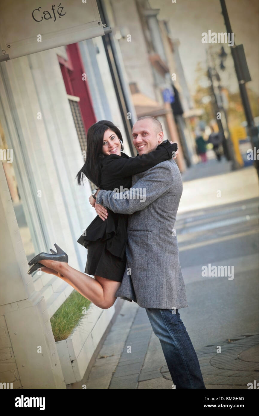 Man lifting woman in embrace hi-res stock photography and images - Alamy