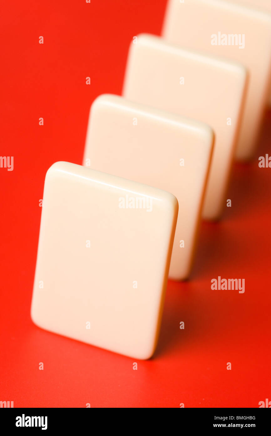 Domino with red background, Concept of Cause or Teamwork Stock Photo ...