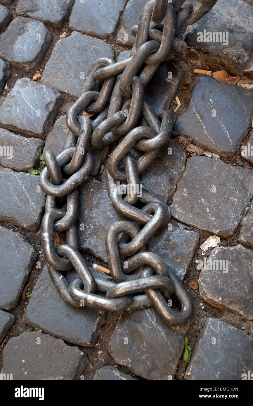 iron chain on ground floor stones Rome Italy Stock Photo - Alamy