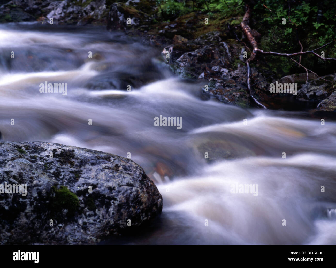 Flowing water of mountain stream Stock Photo - Alamy