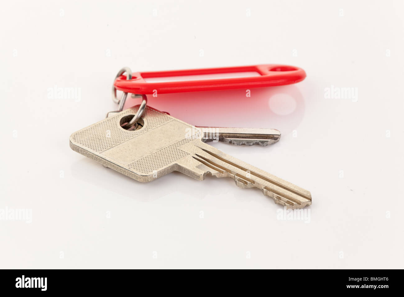 Keys are located on a white background Stock Photo - Alamy