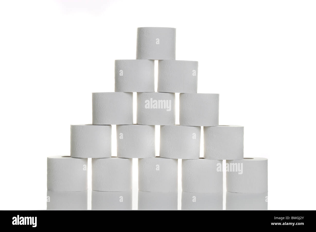 A pyramid of toilet paper on a white background Stock Photo - Alamy