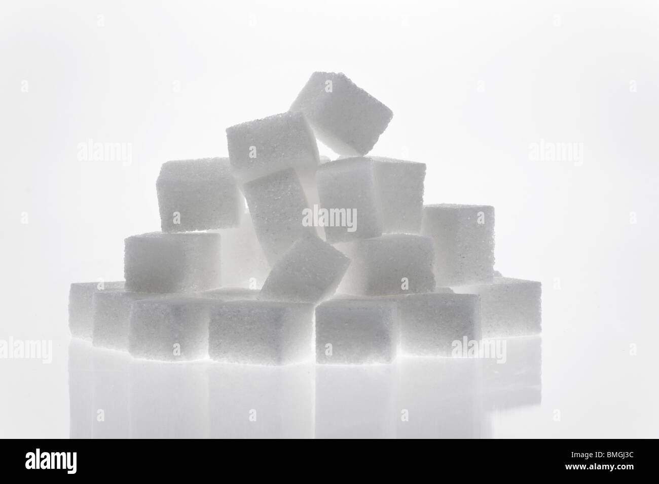Many pieces of sugar to sweeten it isolated on a white background Stock ...