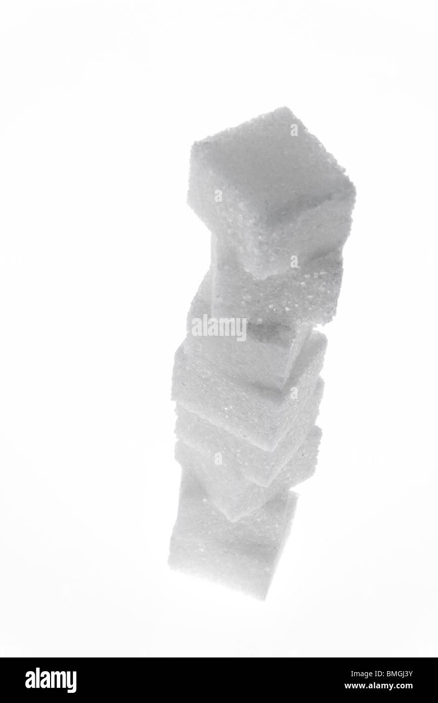 Many pieces of sugar to sweeten it isolated on a white background Stock ...