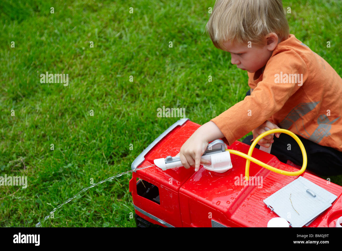 Boy with toy fire engine hi-res stock photography and images - Alamy