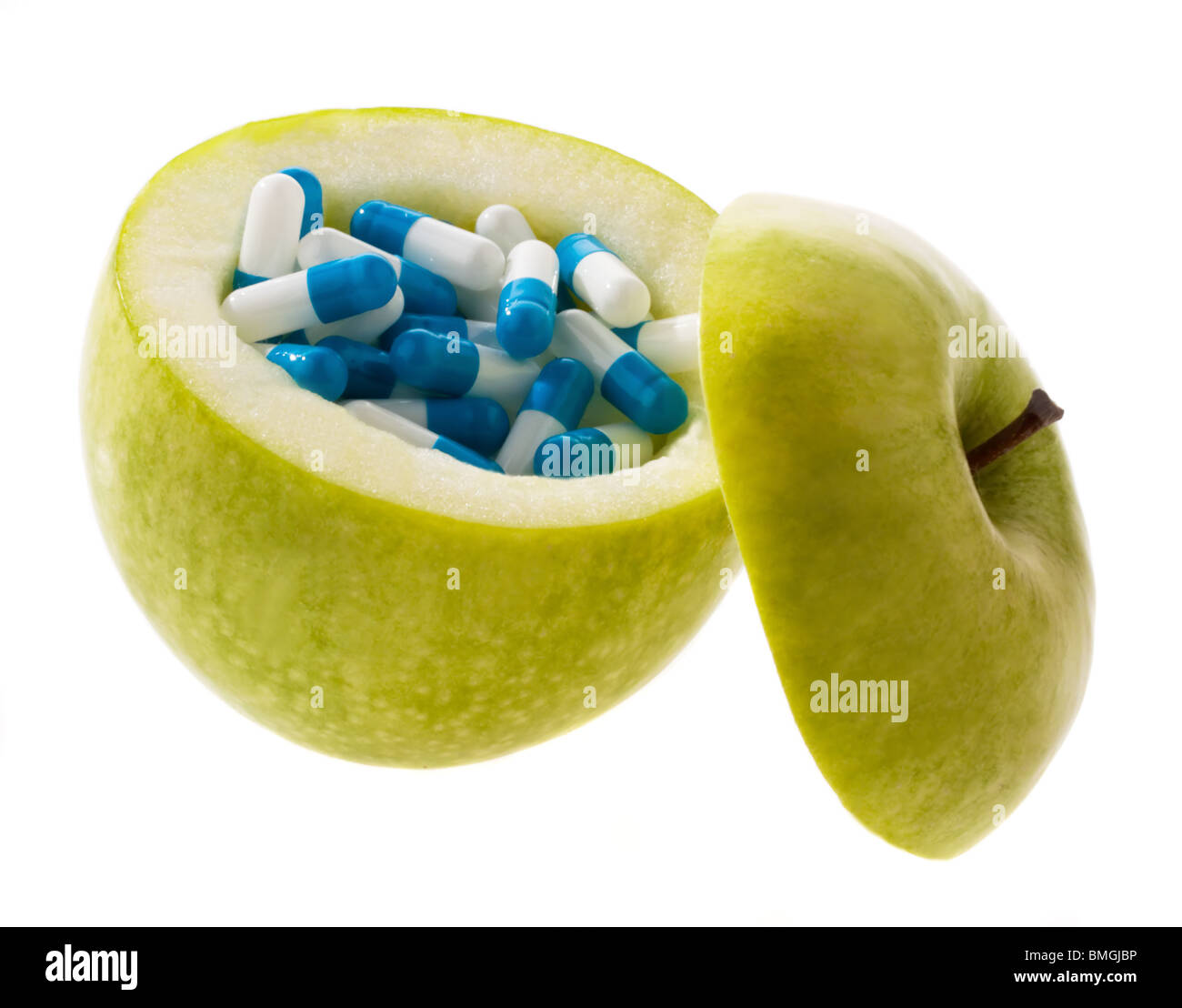 Apple with tablets capsules. Representative photo for vitamin tablets ...