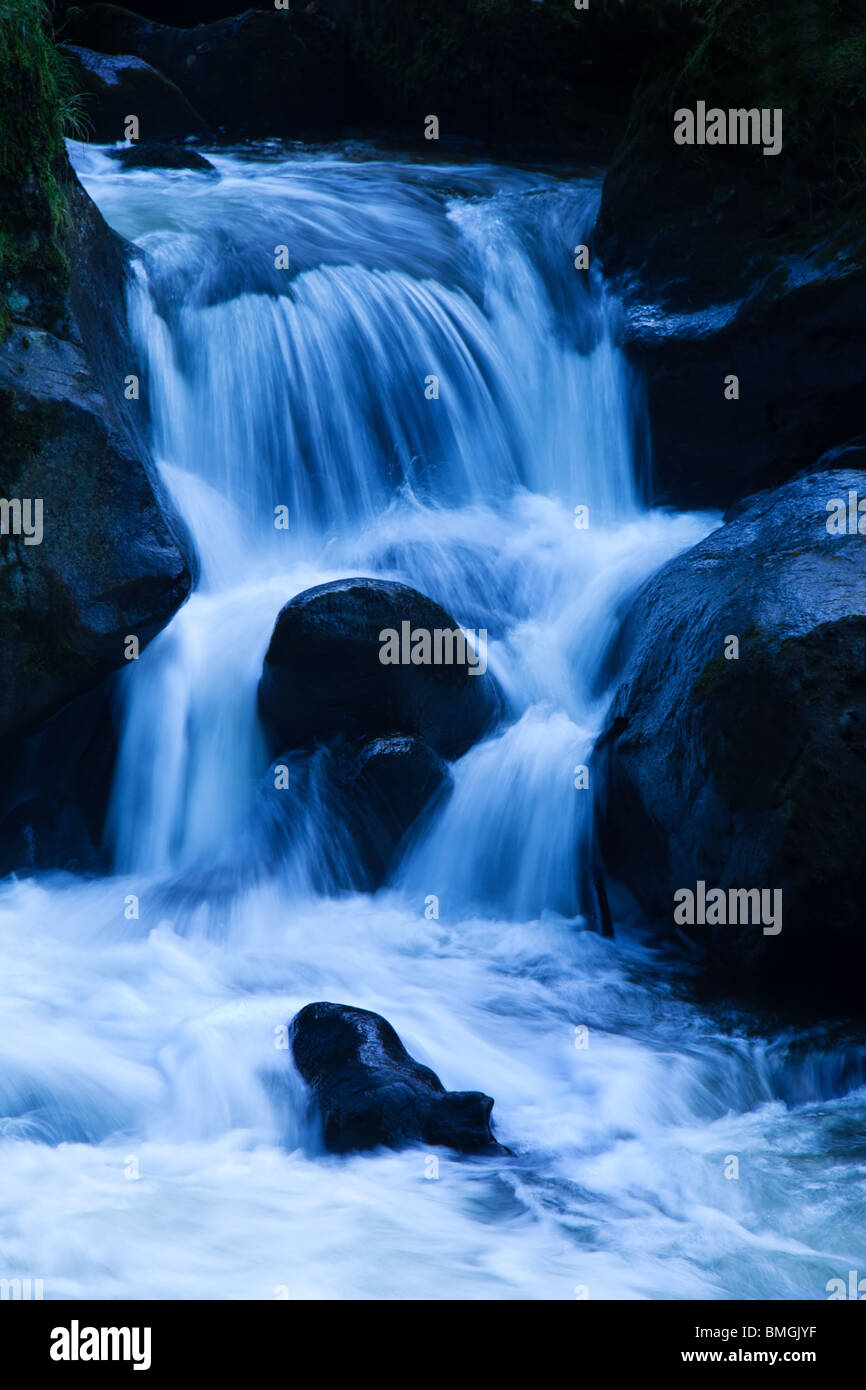 A stream with running water and stones (rocks Stock Photo - Alamy