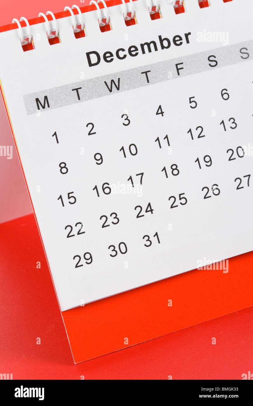 Calendar December close up with red background Stock Photo - Alamy