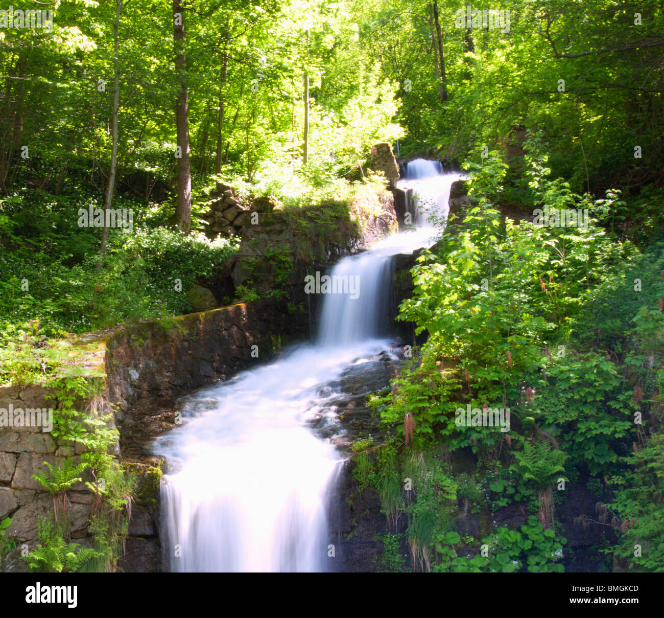 Beautiful falls of water on the side of a mountain Stock Photo - Alamy
