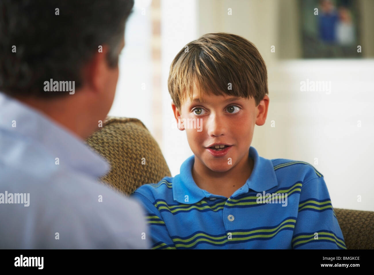 A Father And Son Talking Together Stock Photo - Alamy