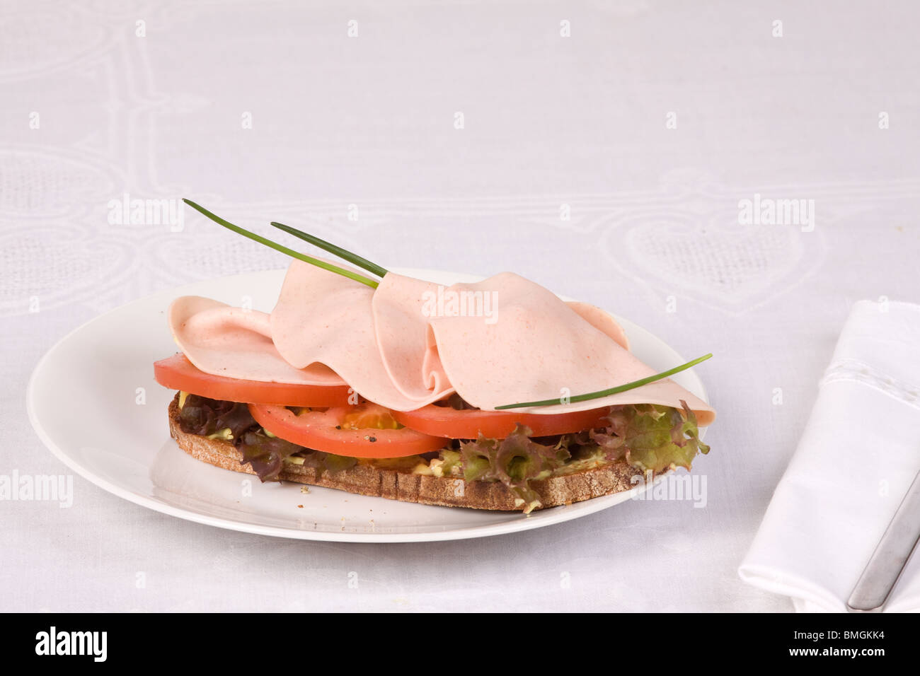 Mortadella with slices cut hi-res stock photography and images - Alamy