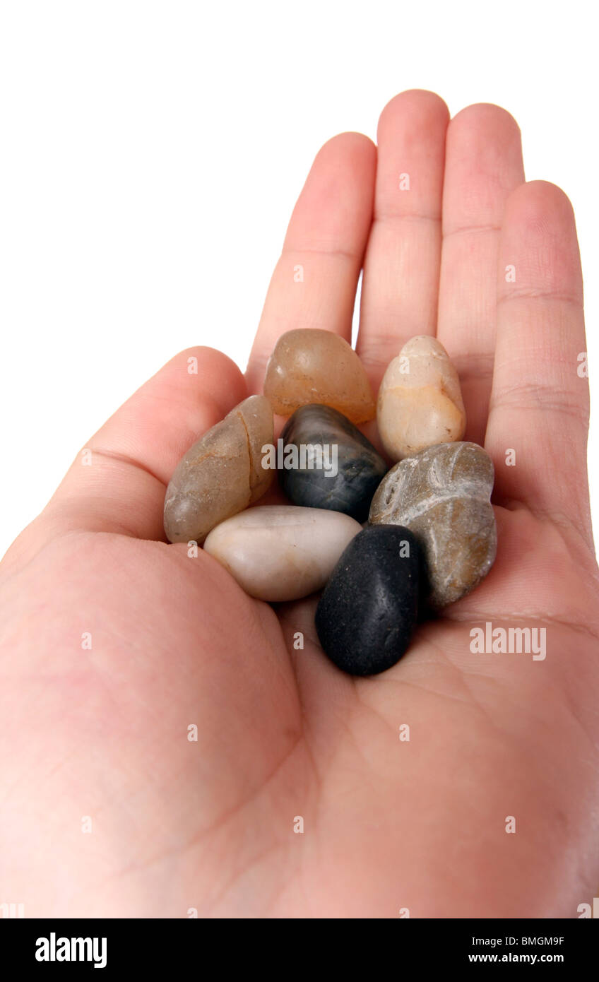 Man holding some pieces of rocks. Isolate on white Stock Photo - Alamy