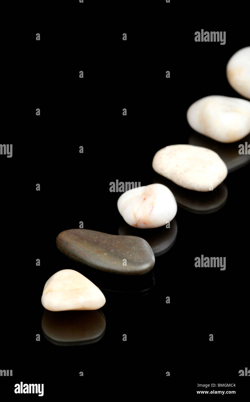 Concept made by many rocks isolated on black Stock Photo - Alamy