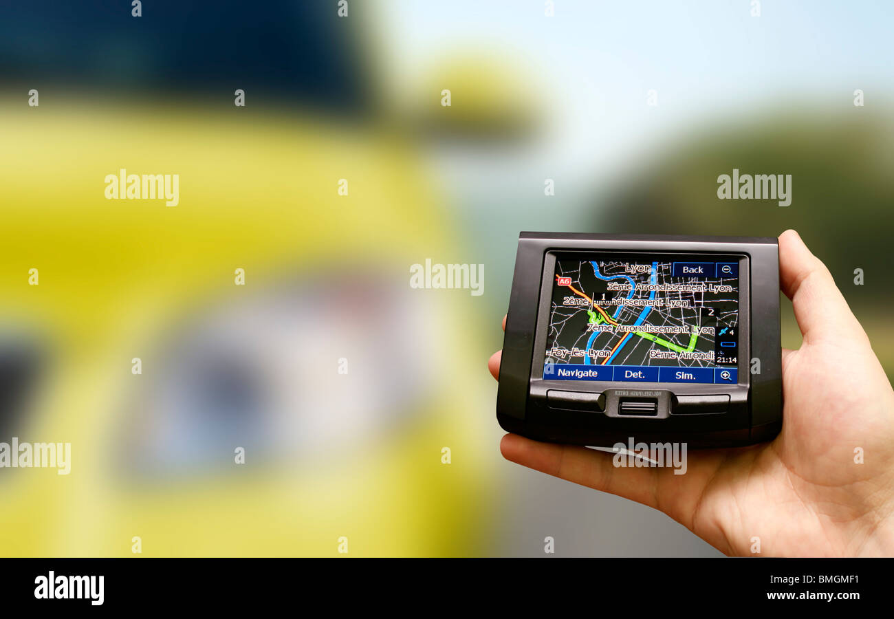Gps in a man hand. Find your way ! Stock Photo - Alamy
