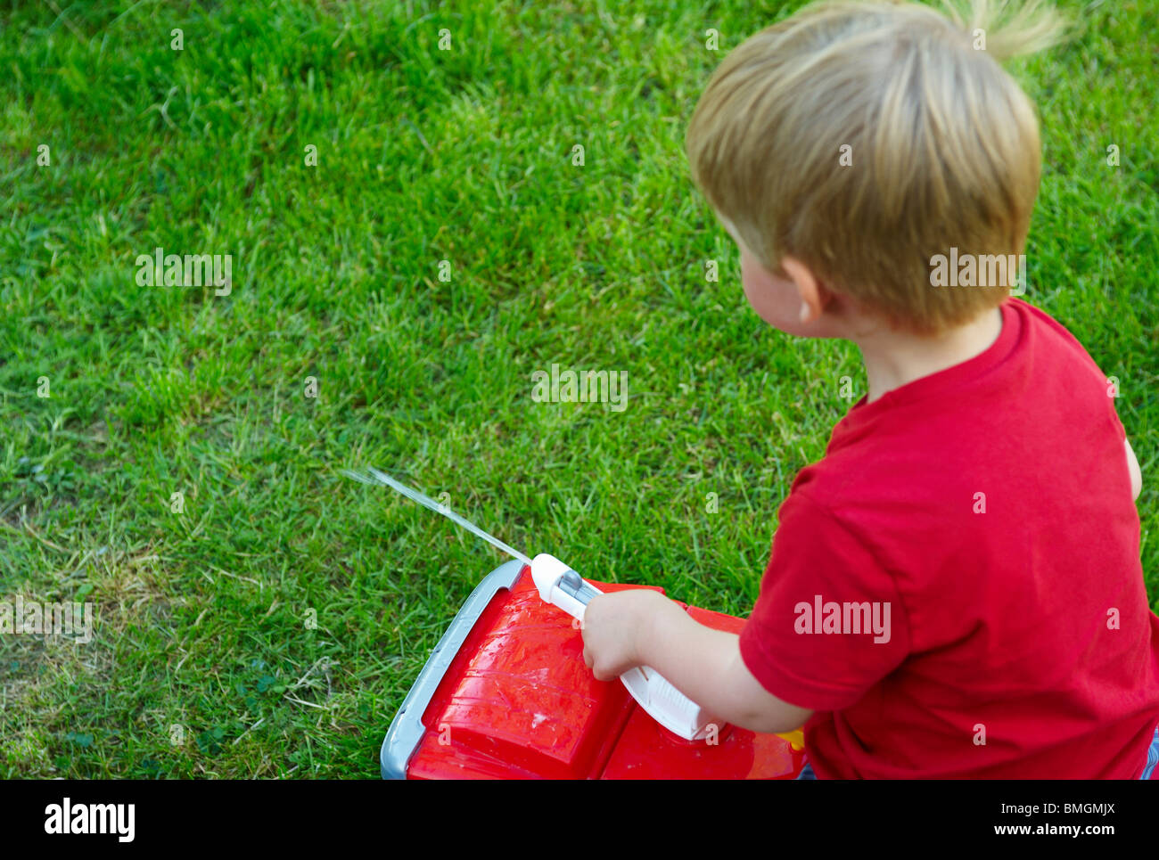 Boy with toy fire engine hi-res stock photography and images - Alamy