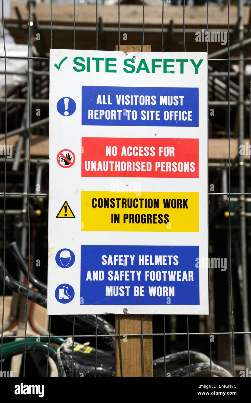 Building site health & safety notice with scaffolding blurred in the ...