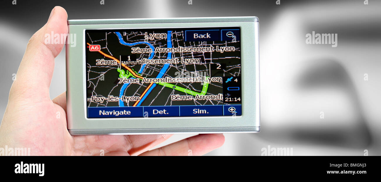 Gps in a man hand. Find your way ! Stock Photo - Alamy
