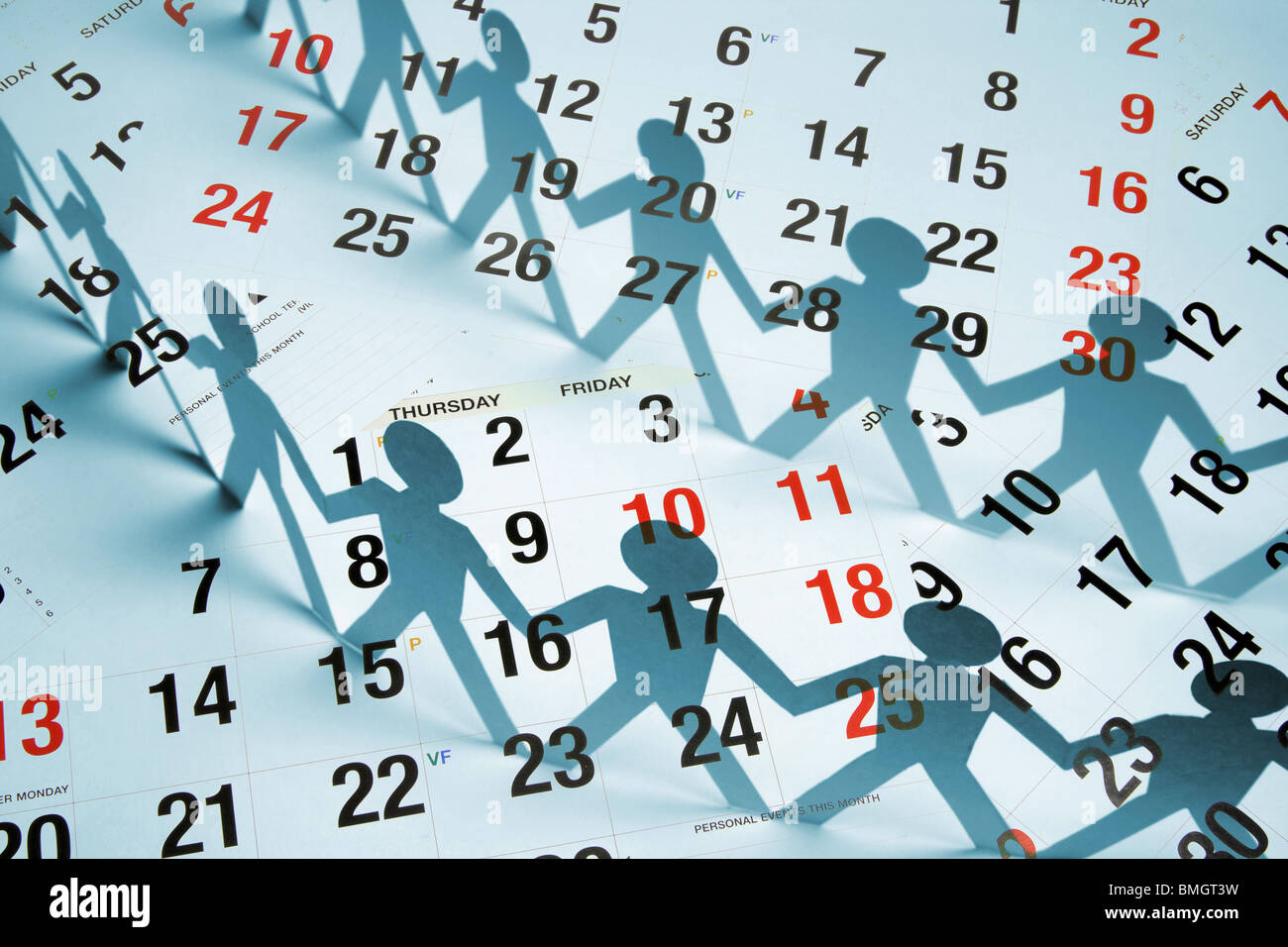 Calendar and Paper Chain Dolls Stock Photo - Alamy