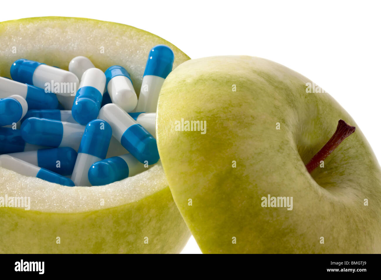 Apple with tablets capsules. Representative photo for vitamin tablets ...