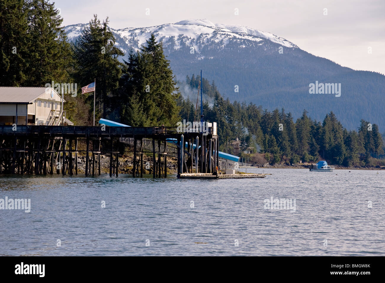 Waterfront pier and mountain in Alaska wilderness Stock Photo - Alamy