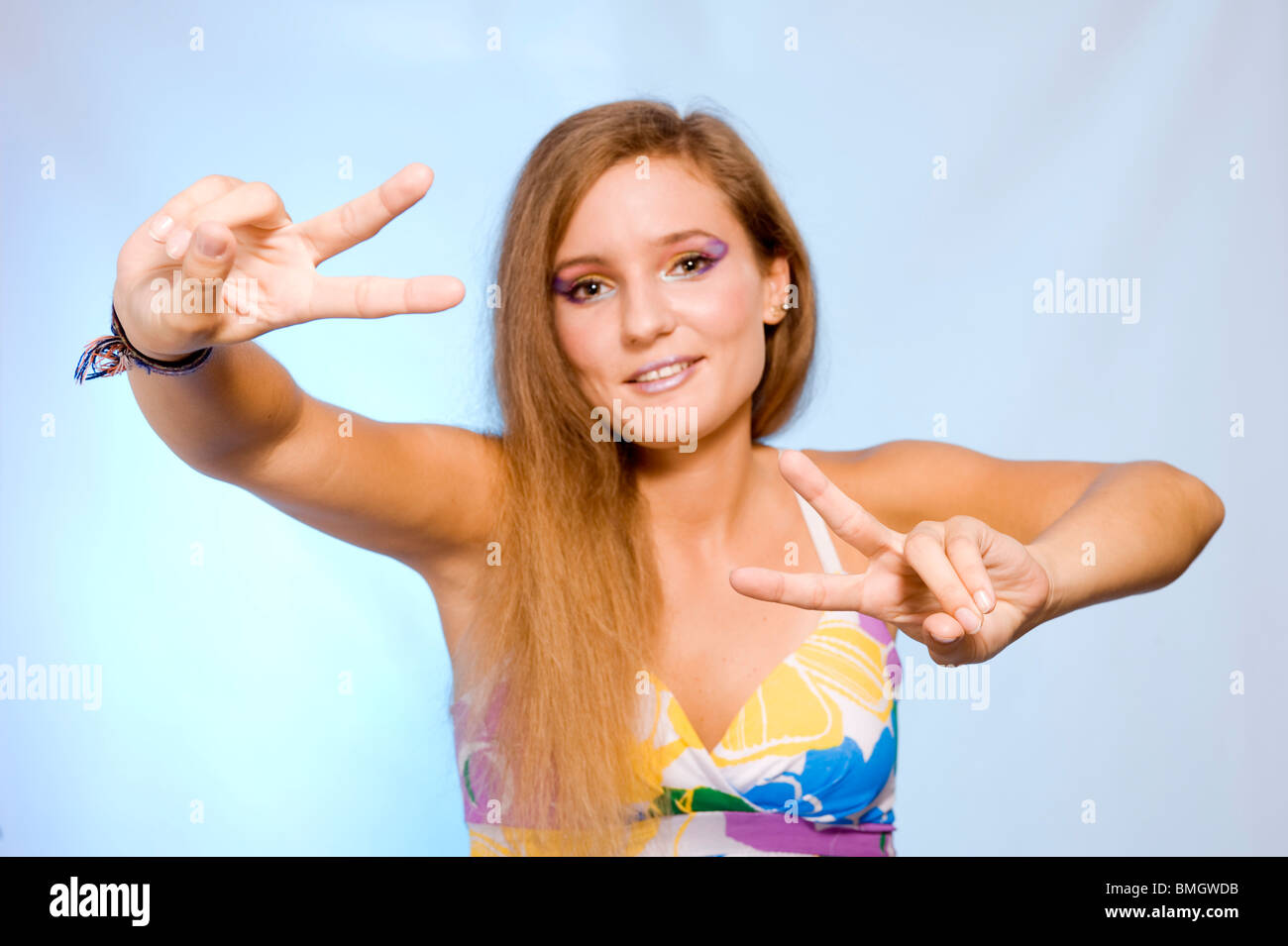 Woman making peace sign hi-res stock photography and images - Alamy