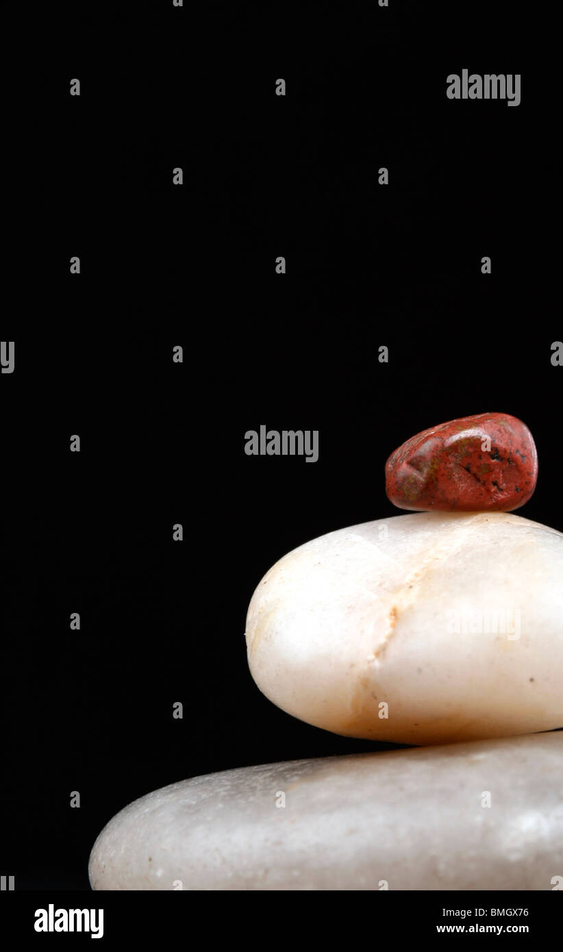 Concept made by many rocks isolated on black Stock Photo - Alamy