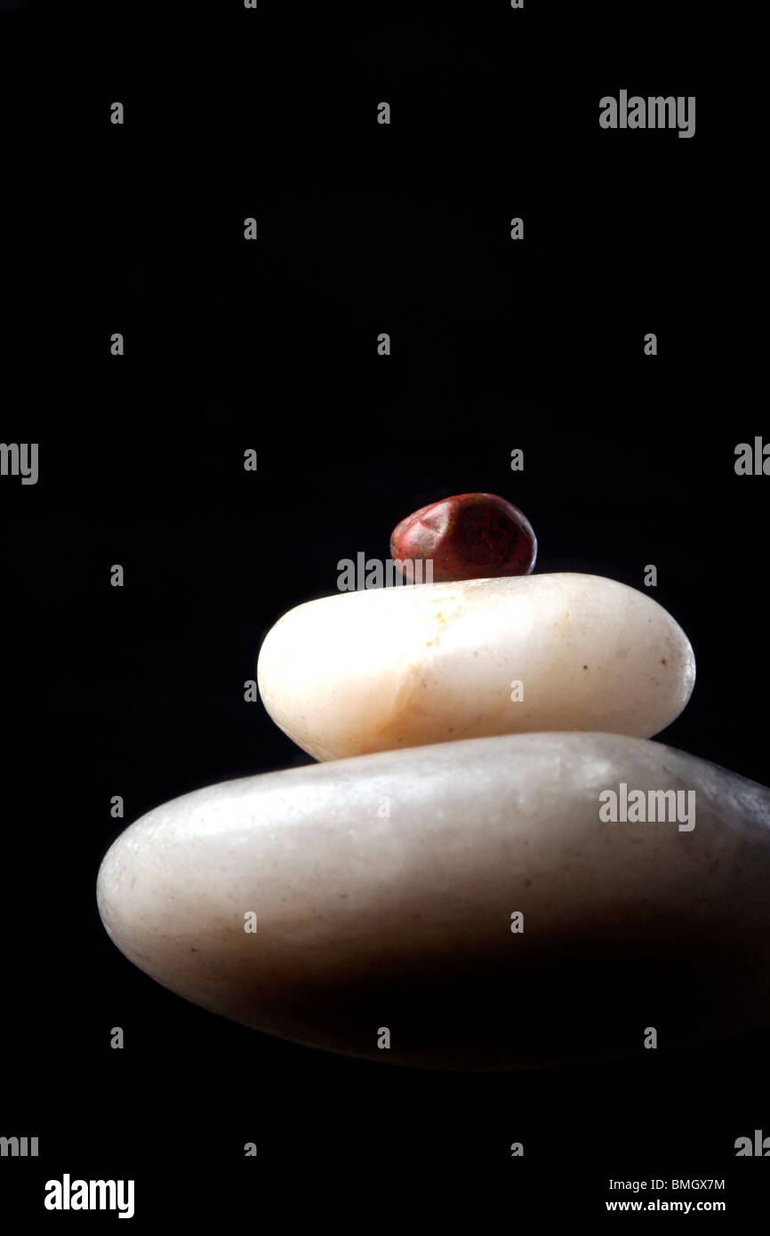 Concept made by many rocks isolated on black Stock Photo - Alamy