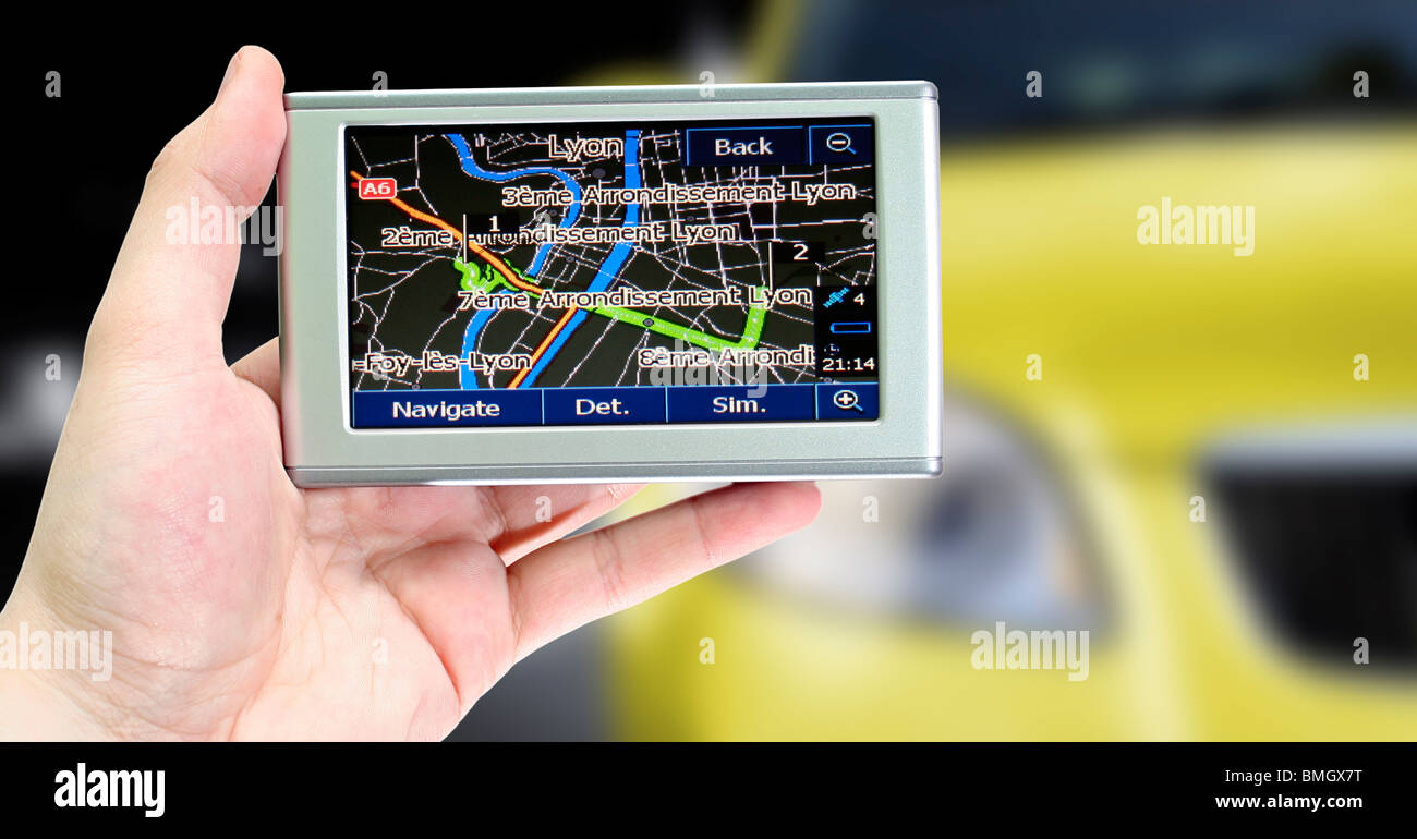 Gps in a man hand. Find your way ! Stock Photo - Alamy