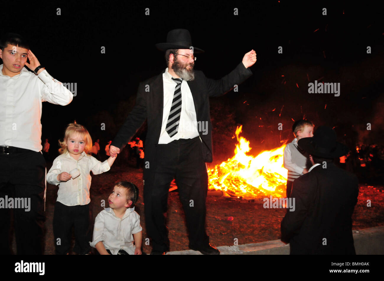 Israel, Haifa, Neve Shaanan, Jews dance around the bonfire during the ...