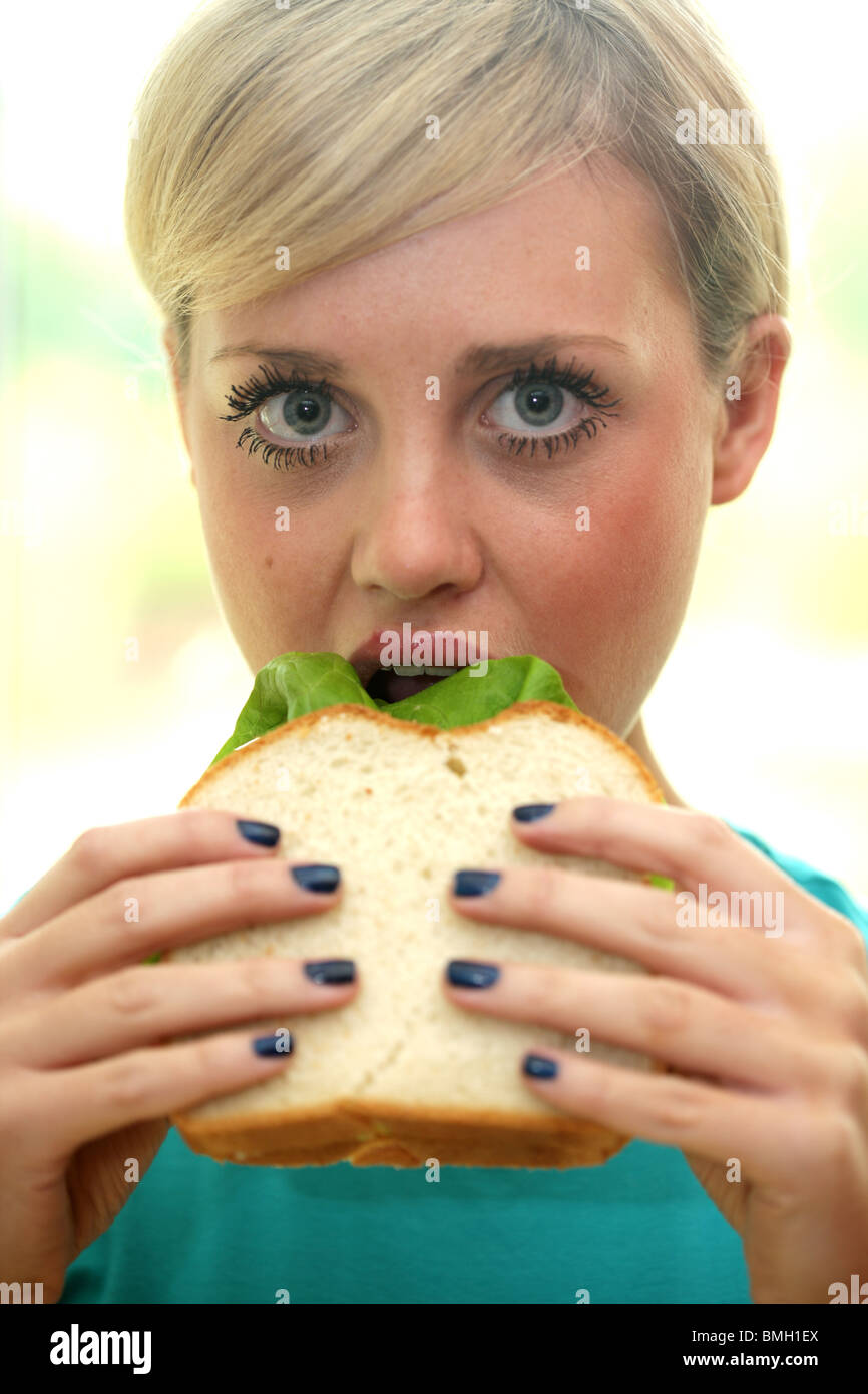 Teenage Girl Eating Sandwich. Model Released Stock Photo - Alamy