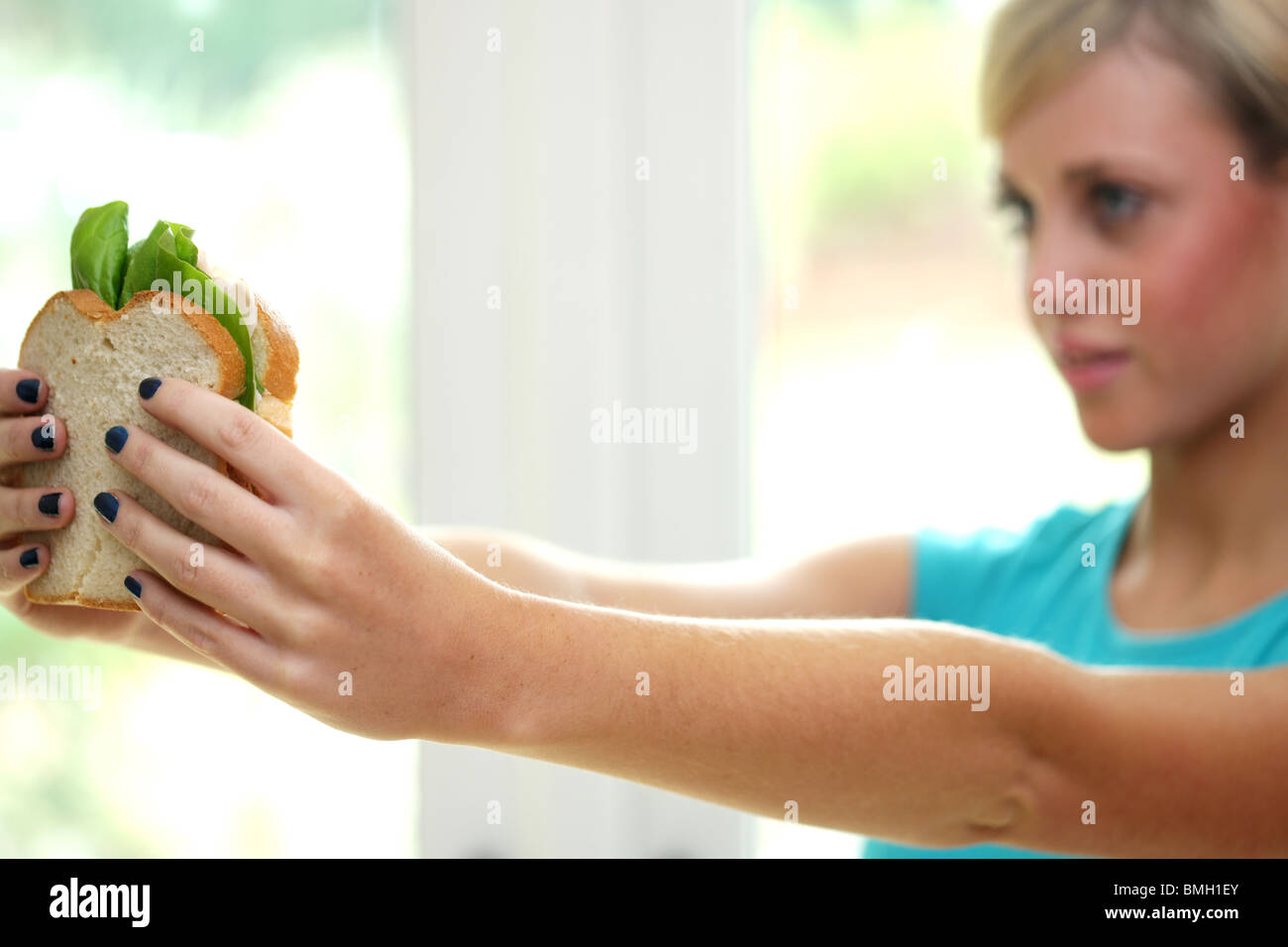 Teenage Girl Eating Sandwich. Model Released Stock Photo - Alamy