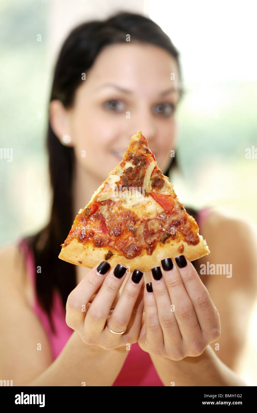 Woman eating pizza slim hi-res stock photography and images - Alamy