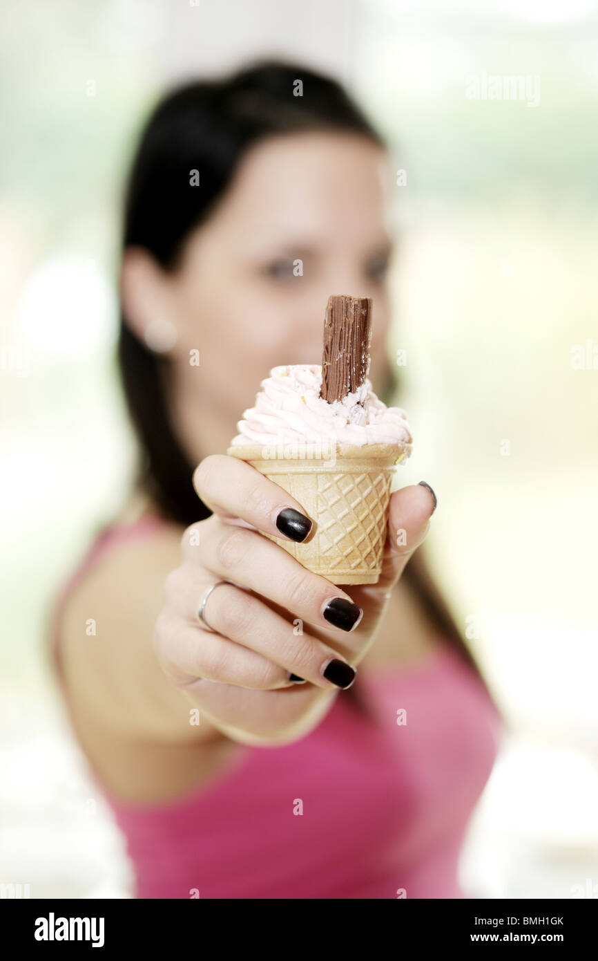 Teenage Girl Eating Cream Cake. Model Released Stock Photo - Alamy