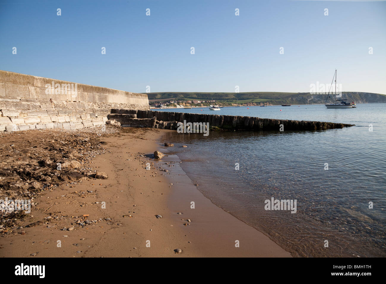 stone groynes and sea wall at Swanage bay Stock Photo - Alamy