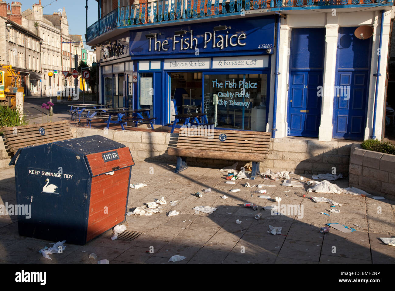 litter and rubbish left outside a seaside chip shop to be cleared up ...