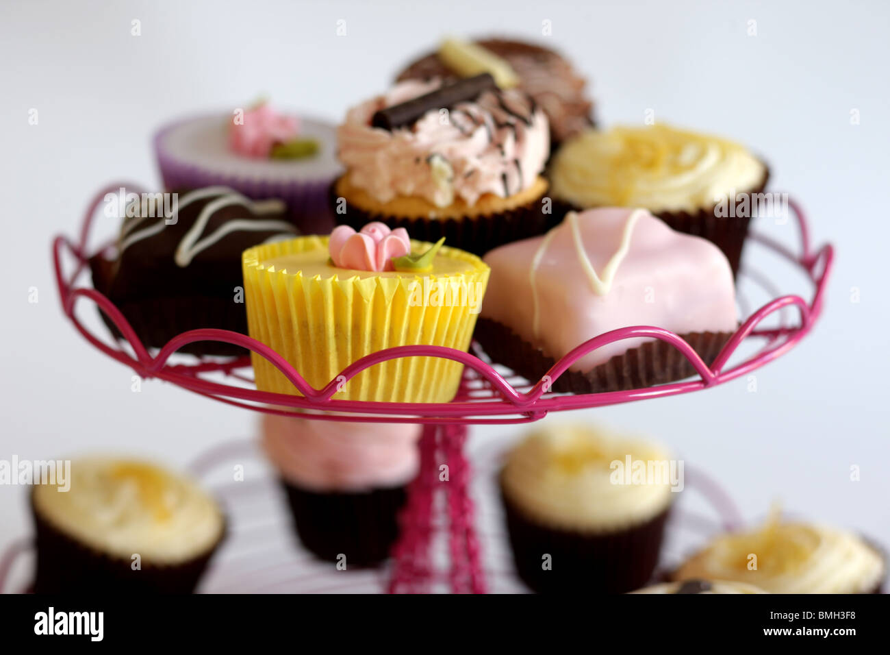 Selection Of Assorted Individual Cup Cakes And Fancy Fondant Iced Cakes ...