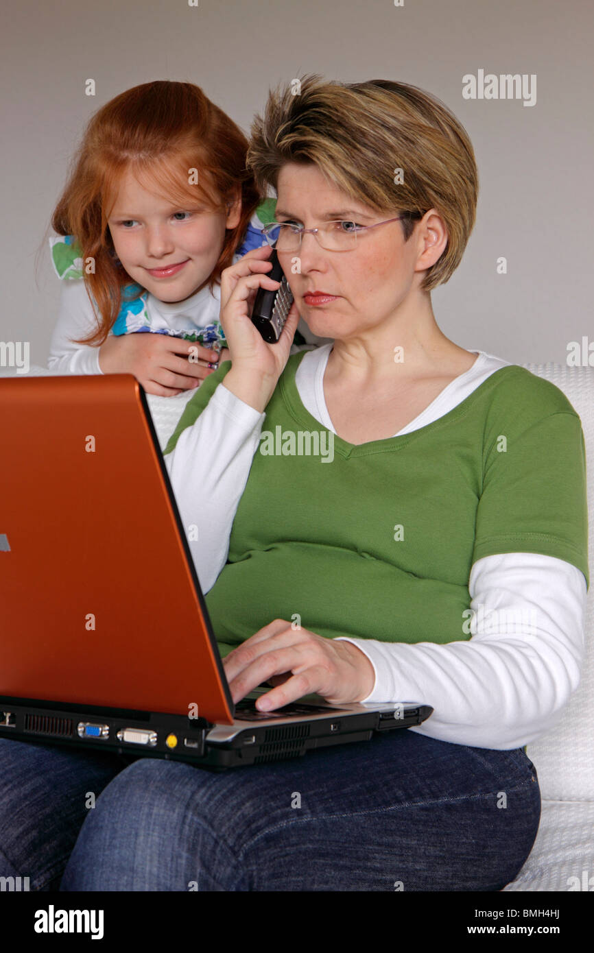 Stern woman and computer hi-res stock photography and images - Alamy