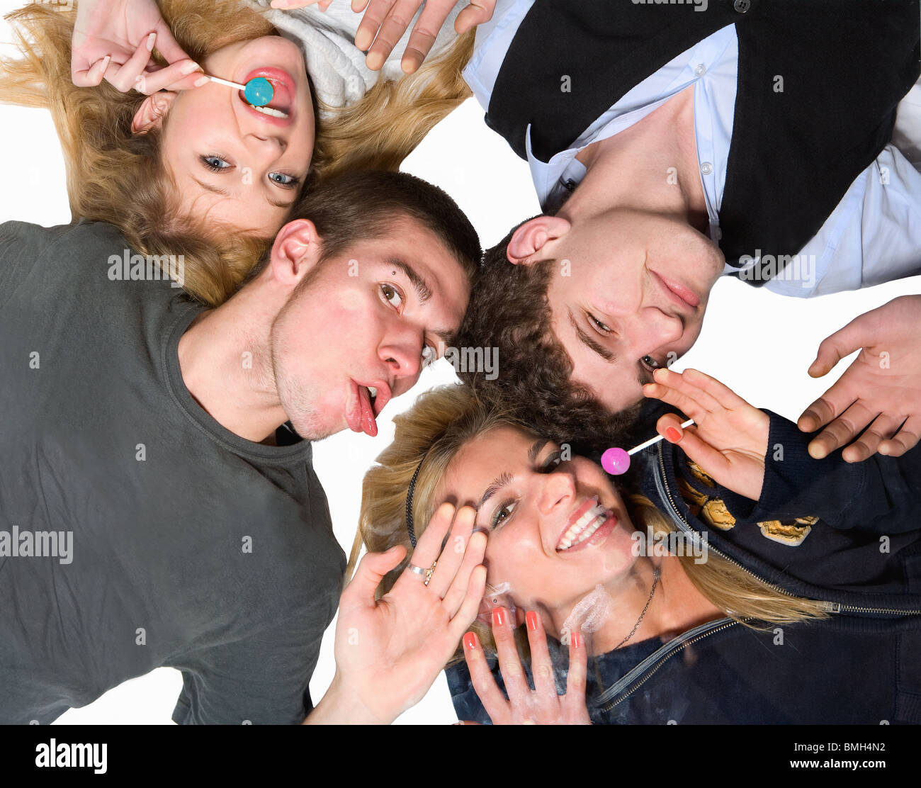 Teen group pushed against window Stock Photo - Alamy