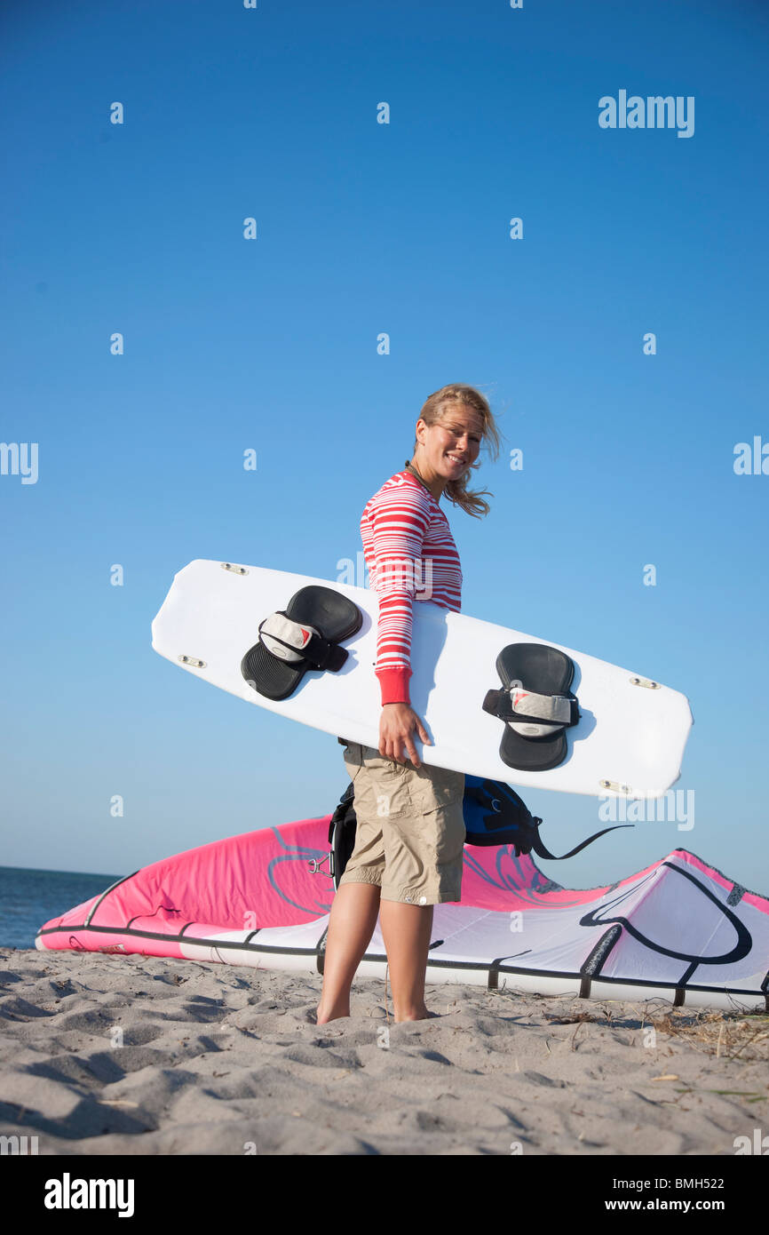 Female kitesurfer on beach Stock Photo - Alamy