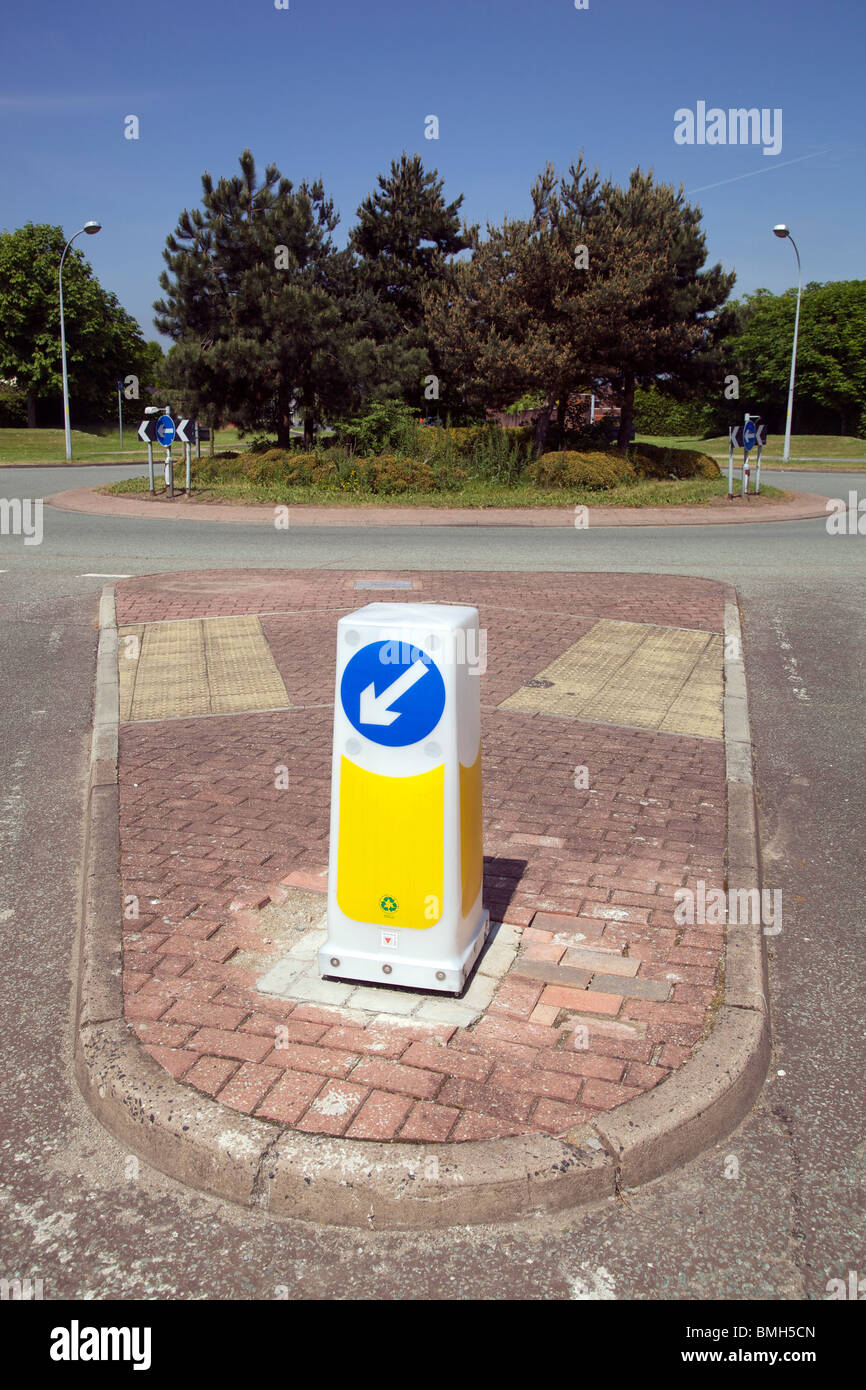 Keep left roadsign on a traffic island Stock Photo - Alamy