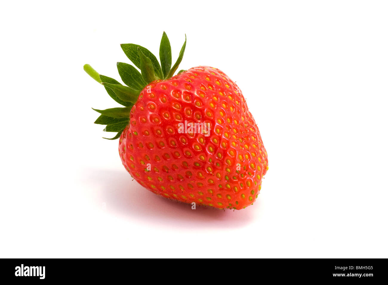 single strawberry on a white background Stock Photo - Alamy