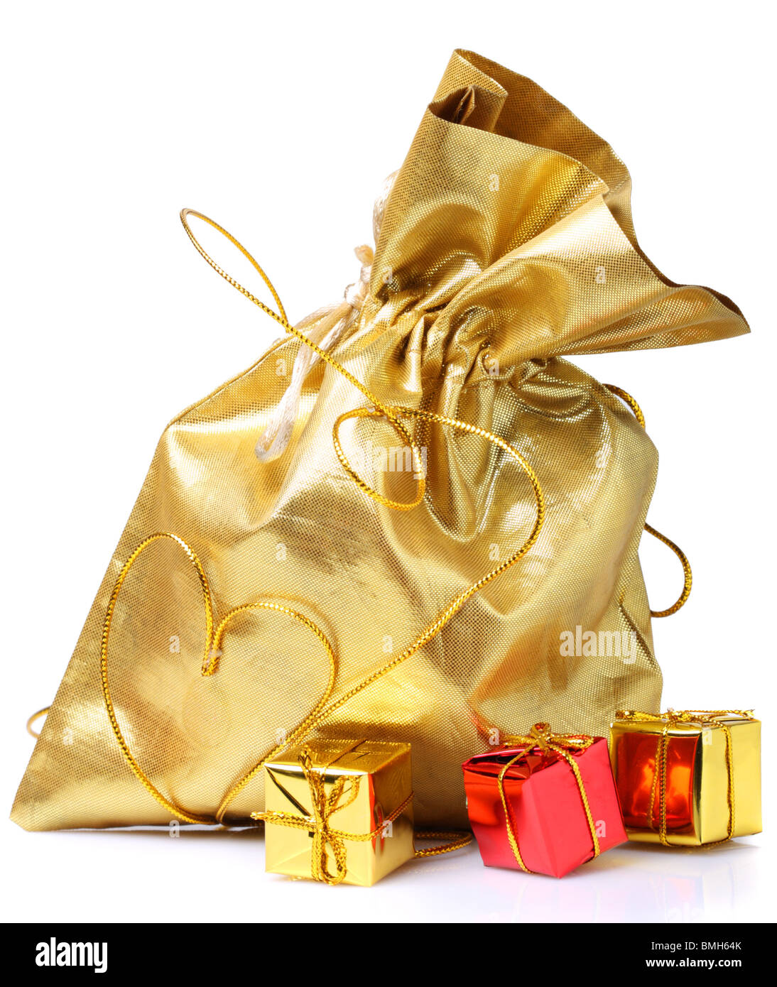 Golden bag with gifts isolated on white Stock Photo - Alamy