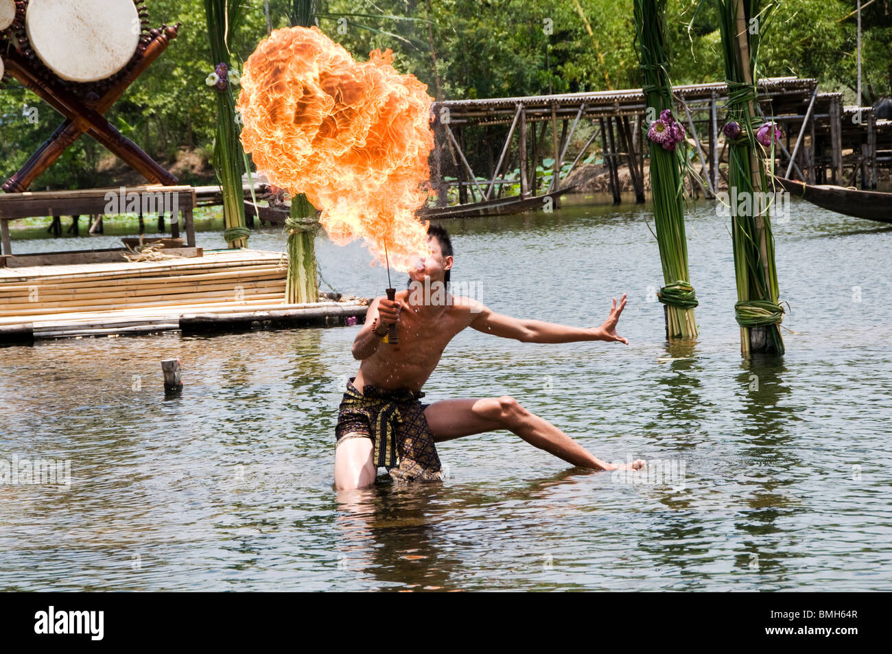 fire eater show at outdoor water theatre, Klong sra bua floating market ...