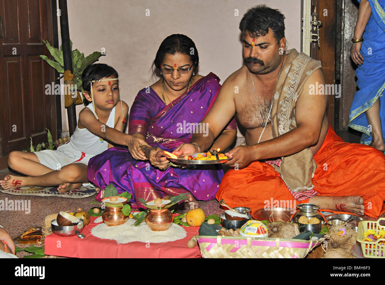 Munjan Ceremony- The child with his parents performing Pooja a part of ...