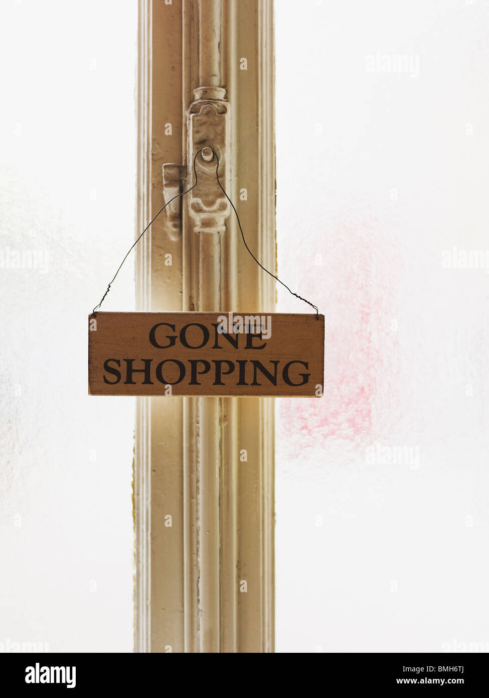 Shopping-sign hanging on window Stock Photo - Alamy