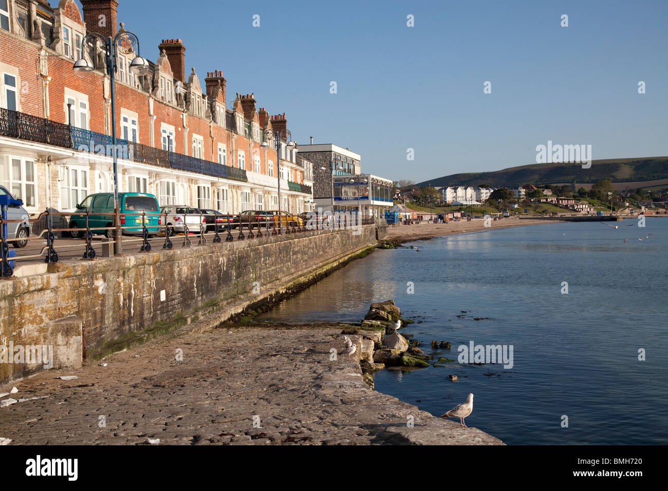 promenade, sea wall, slipway and stone groynes at Swanage in the early ...