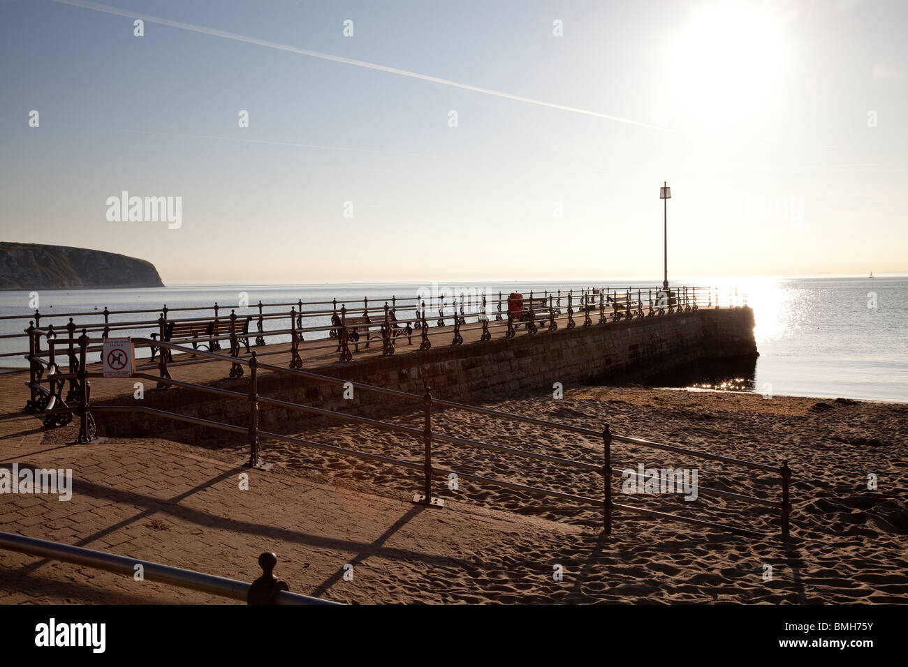 Stone jetty / pier in early morning sunlight at Swanage Stock Photo - Alamy